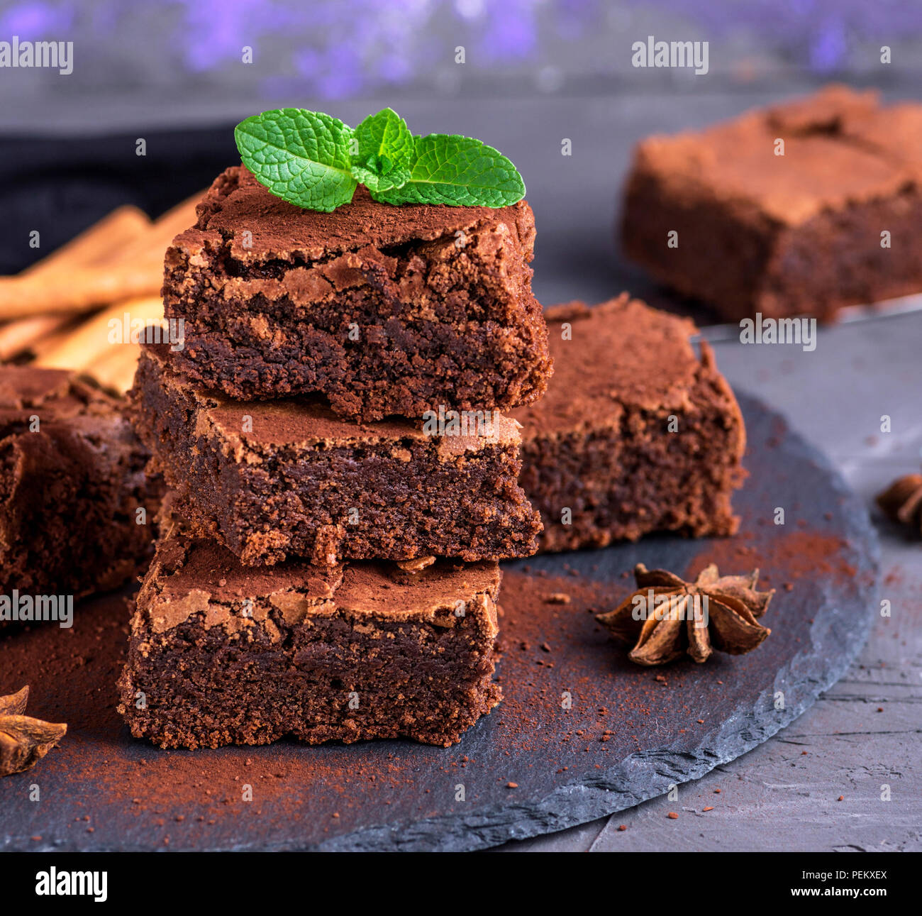 pile of square baked pieces of chocolate brownie pie, close up Stock ...