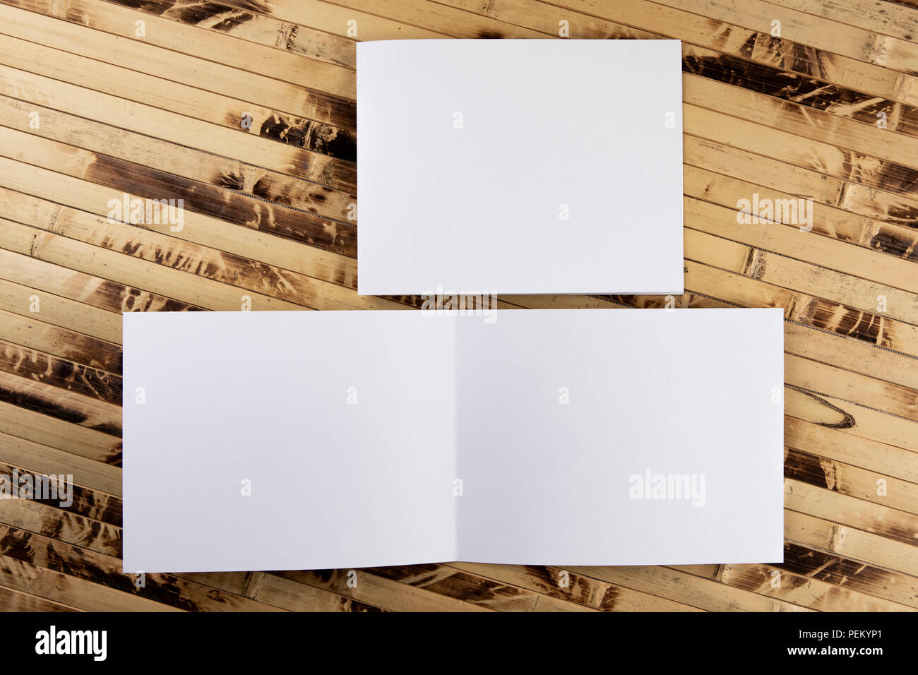 Mockup of white booklet on bamboo background Stock Photo - Alamy