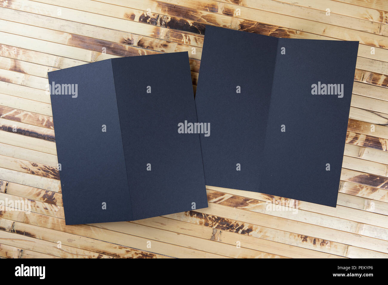 Mockup of black booklet on bamboo background Stock Photo - Alamy