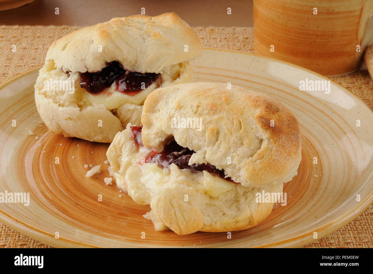 Homemade biscuits with blueberry or strawberry jam Stock Photo - Alamy