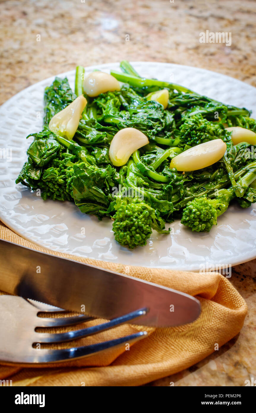 Sauteed broccoli rabe with sweet garlic garlic Stock Photo - Alamy
