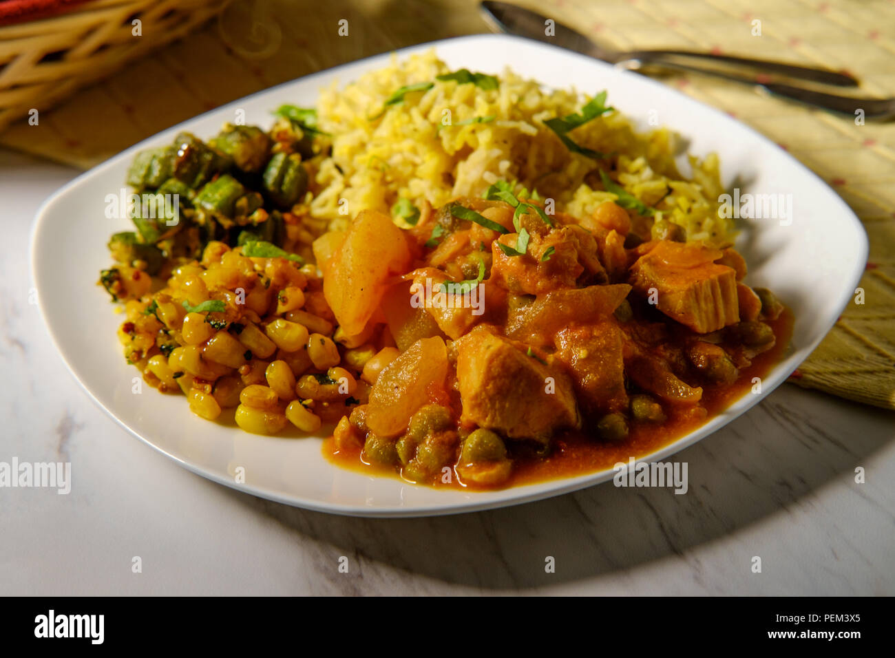 Indian chicken vegetable curry dinner with fried okra biryani rice and ...