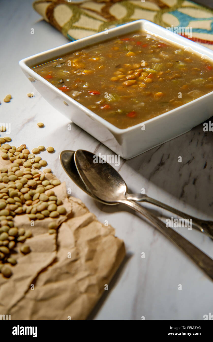 Oven roasted vegetable lentil soup in square shaped bowl Stock Photo ...