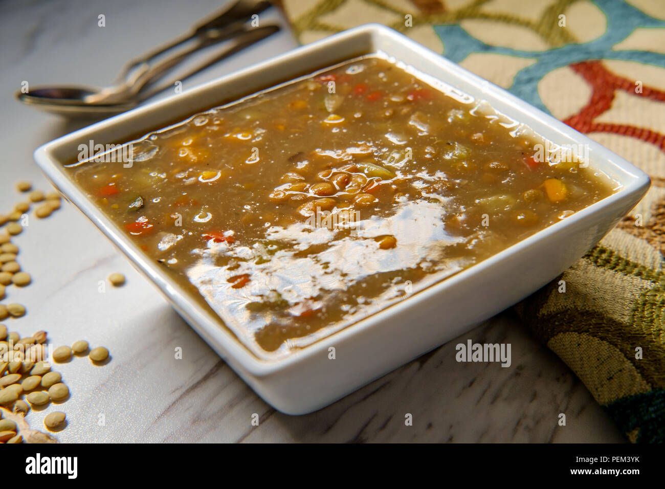 Oven roasted vegetable lentil soup in square shaped bowl Stock Photo ...