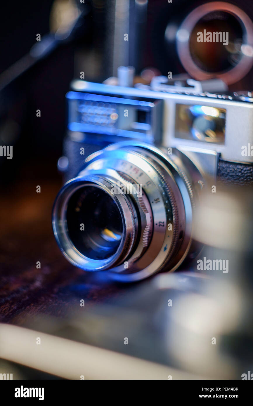Antique film camera on rustic table with dark moody lighting Stock ...