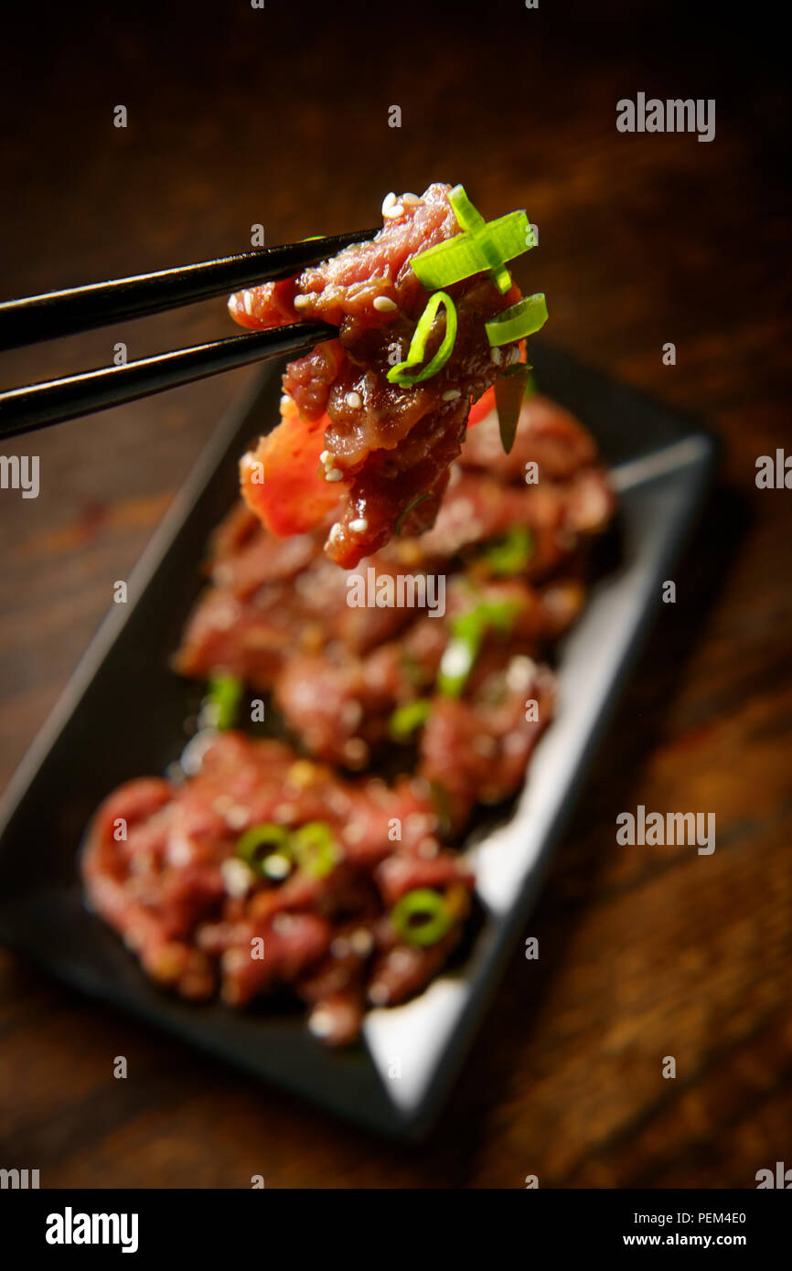 Raw marinating Korean BBQ beef Bulgogi in dark moody lighting Stock ...