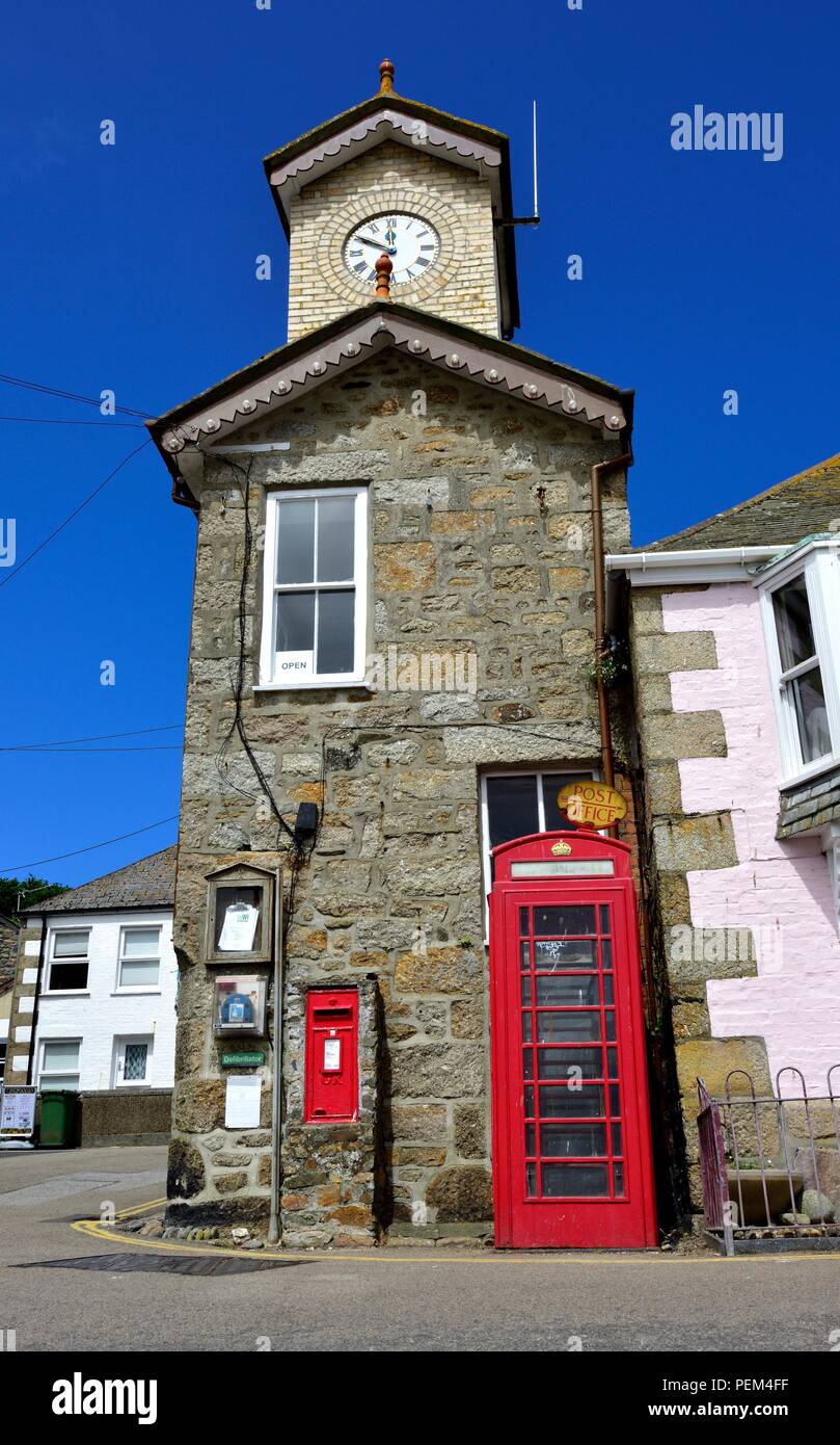 The old post office and clock tower in mousehole,cornwall,England,uk ...