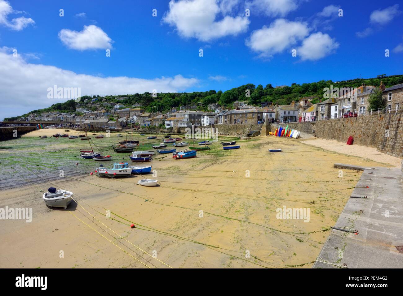 Boats at low tide in Mousehole,Cornwall,England,UK Stock Photo - Alamy