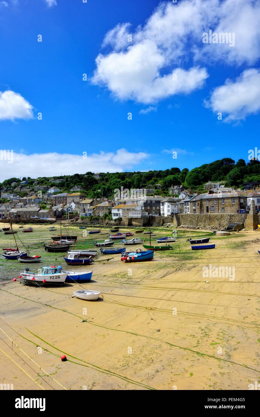 Boats at low tide in Mousehole,Cornwall,England,UK Stock Photo - Alamy