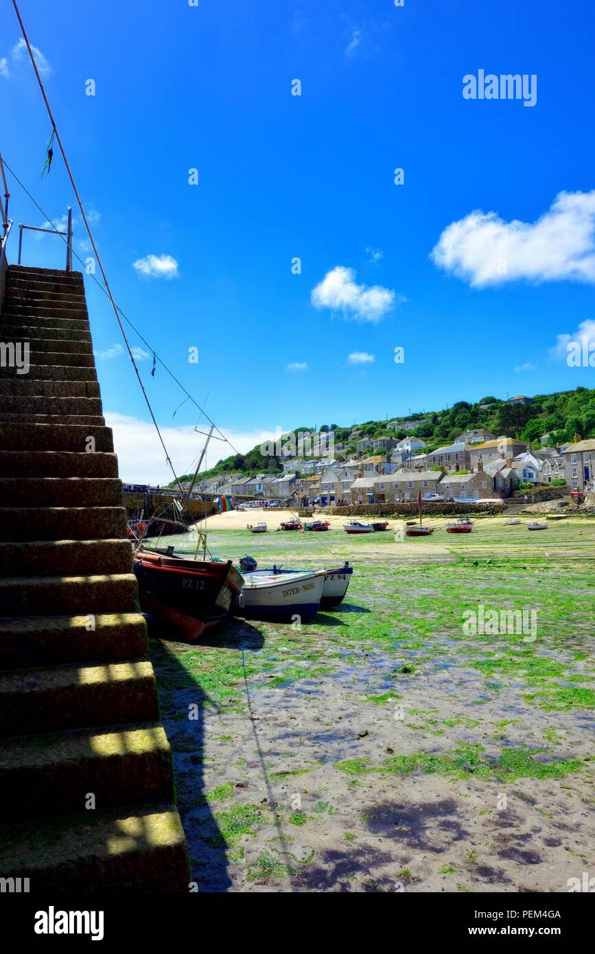 Boats at low tide in Mousehole,Cornwall,England,UK Stock Photo - Alamy