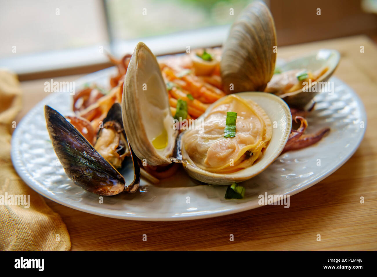 Italian seafood pasta pescatore with clams mussels and squid Stock ...