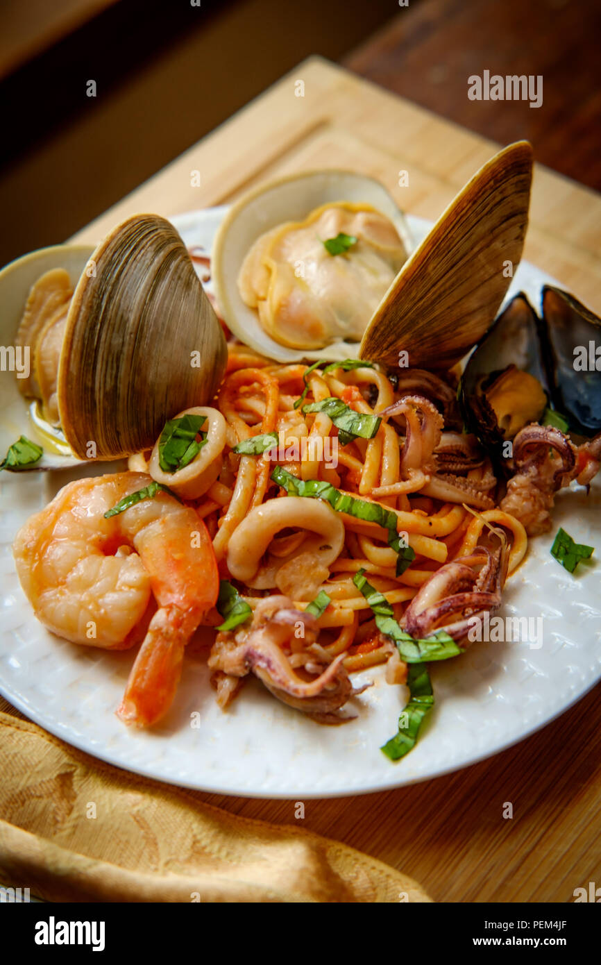 Italian seafood pasta pescatore with clams mussels and squid Stock ...