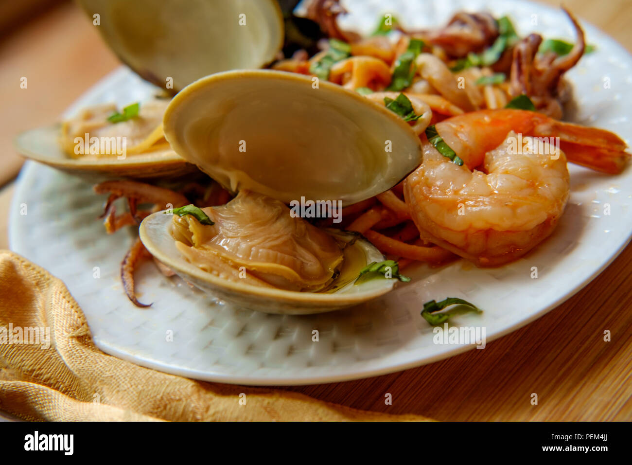 Italian seafood pasta pescatore with clams mussels and squid Stock ...