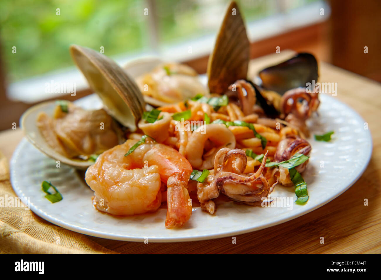 Italian seafood pasta pescatore with clams mussels and squid Stock ...