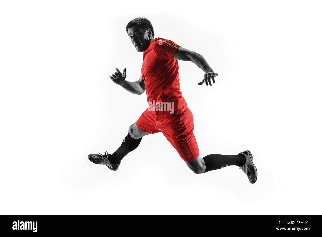 Professional football soccer player in motion isolated on white studio ...