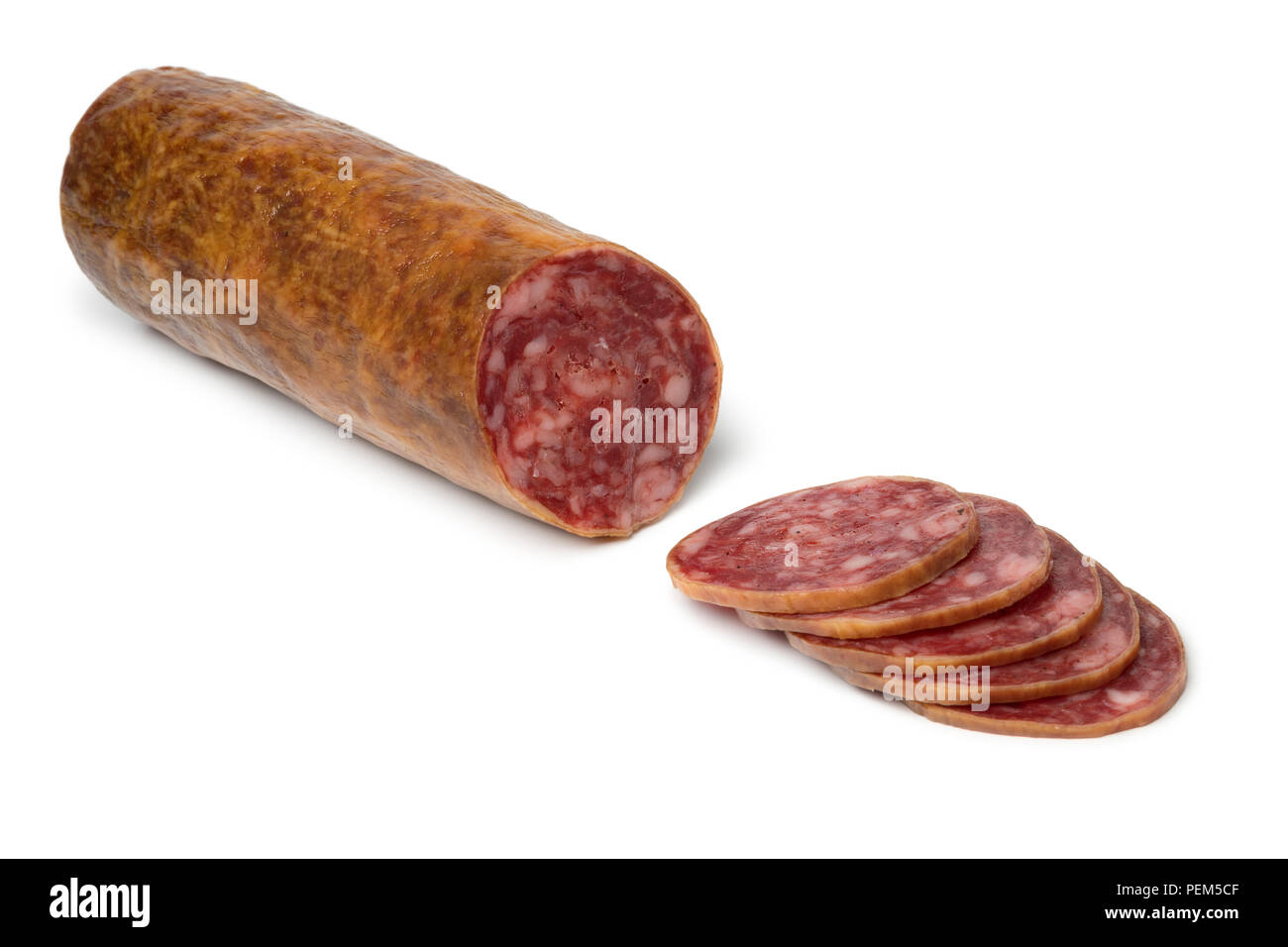 Traditional piece of Spanish Salchichon sausage and slices isolated on ...