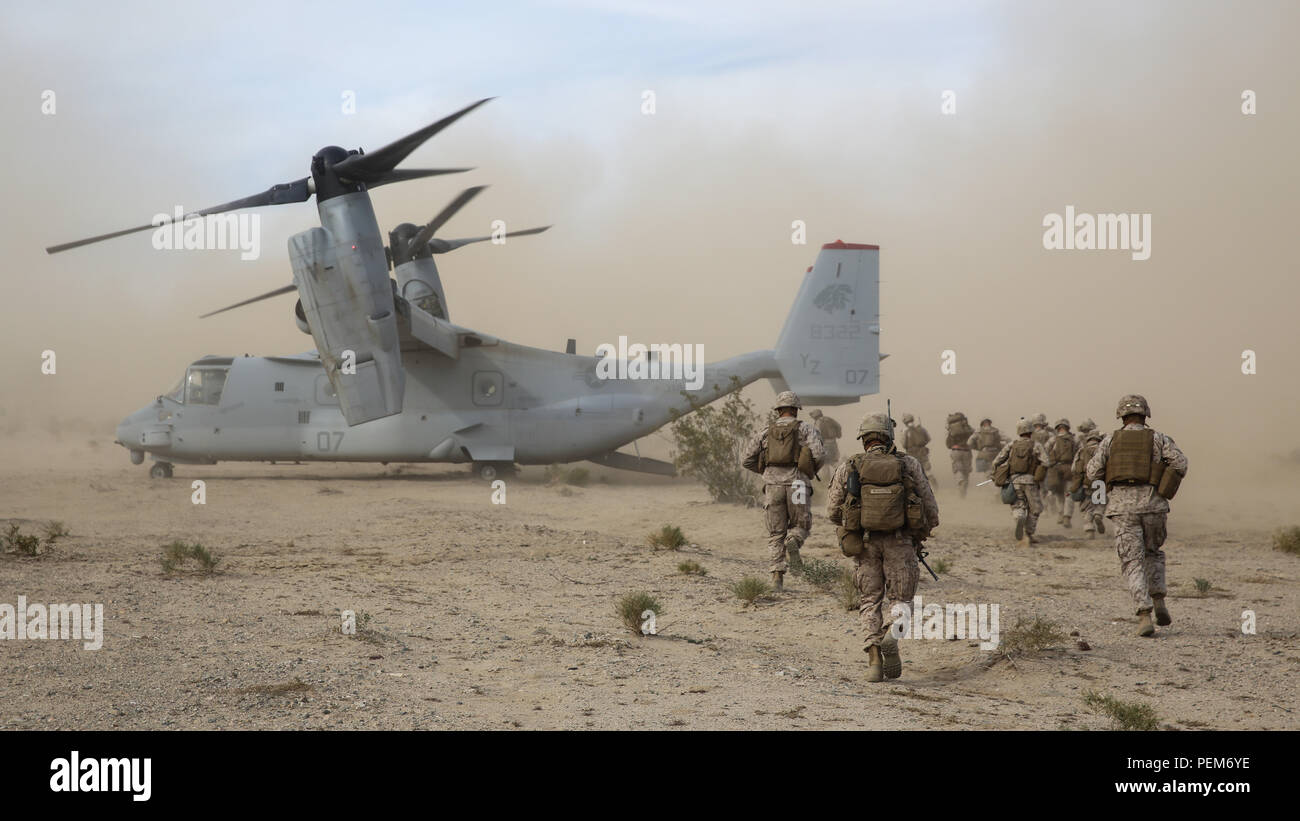 Marines establish a security perimeter around an MV-22B Osprey during a ...
