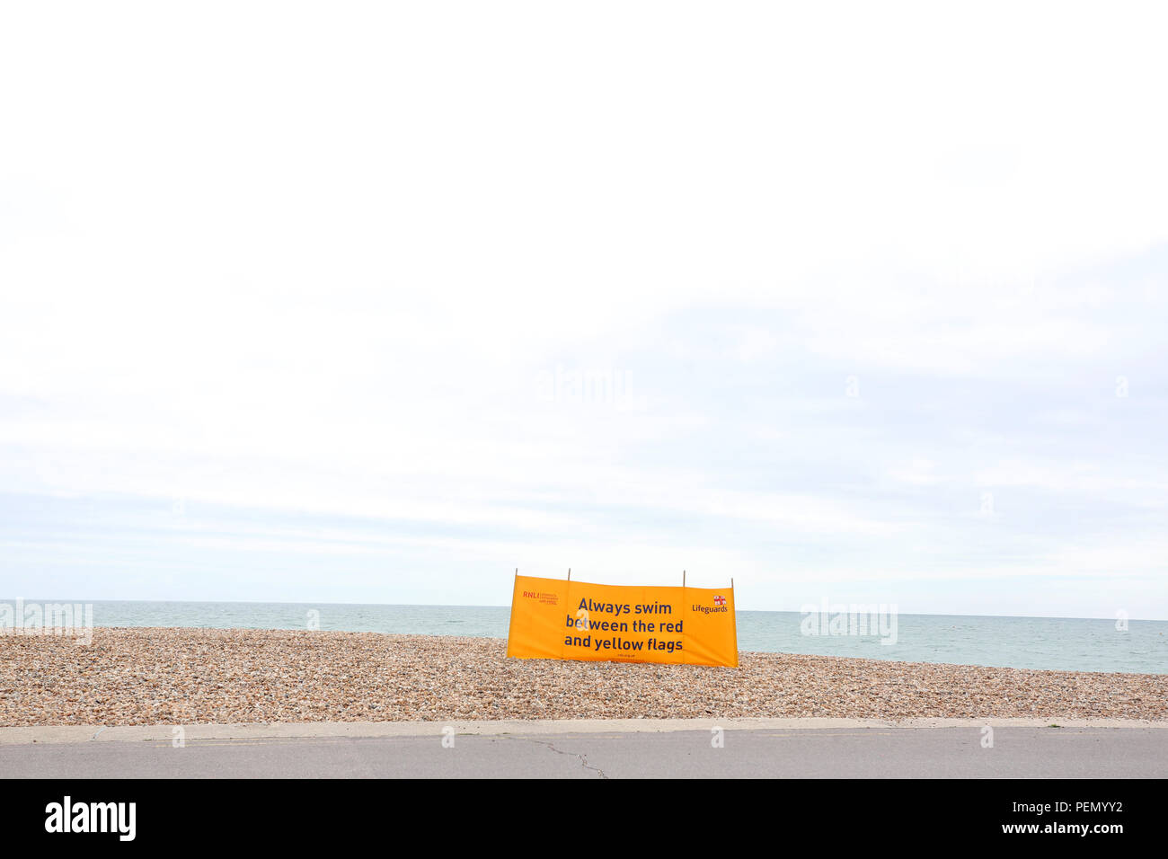 Red and yellow lifeguard flags hi-res stock photography and images - Alamy