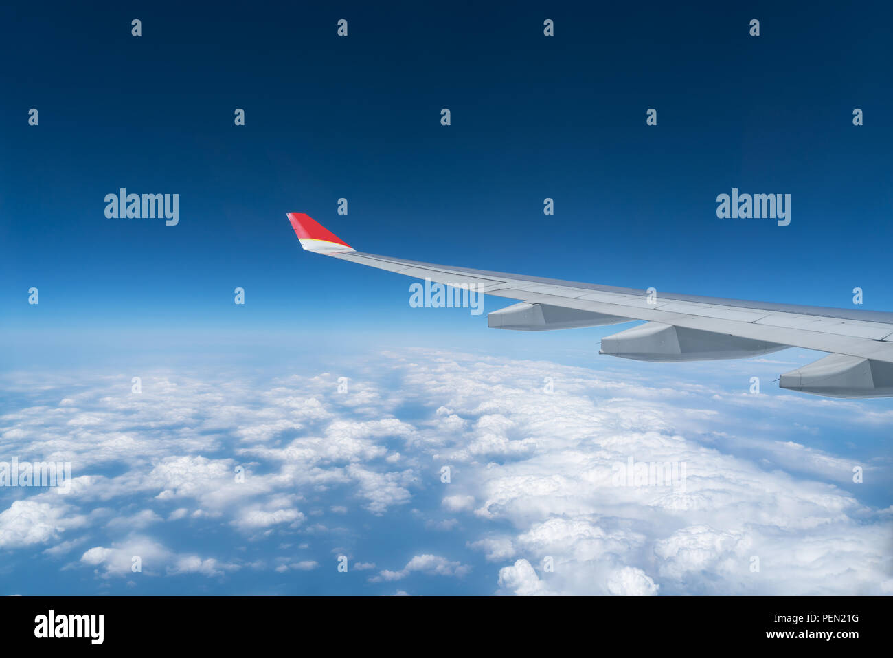 View from airplane window with blue sky and white clouds Stock Photo ...