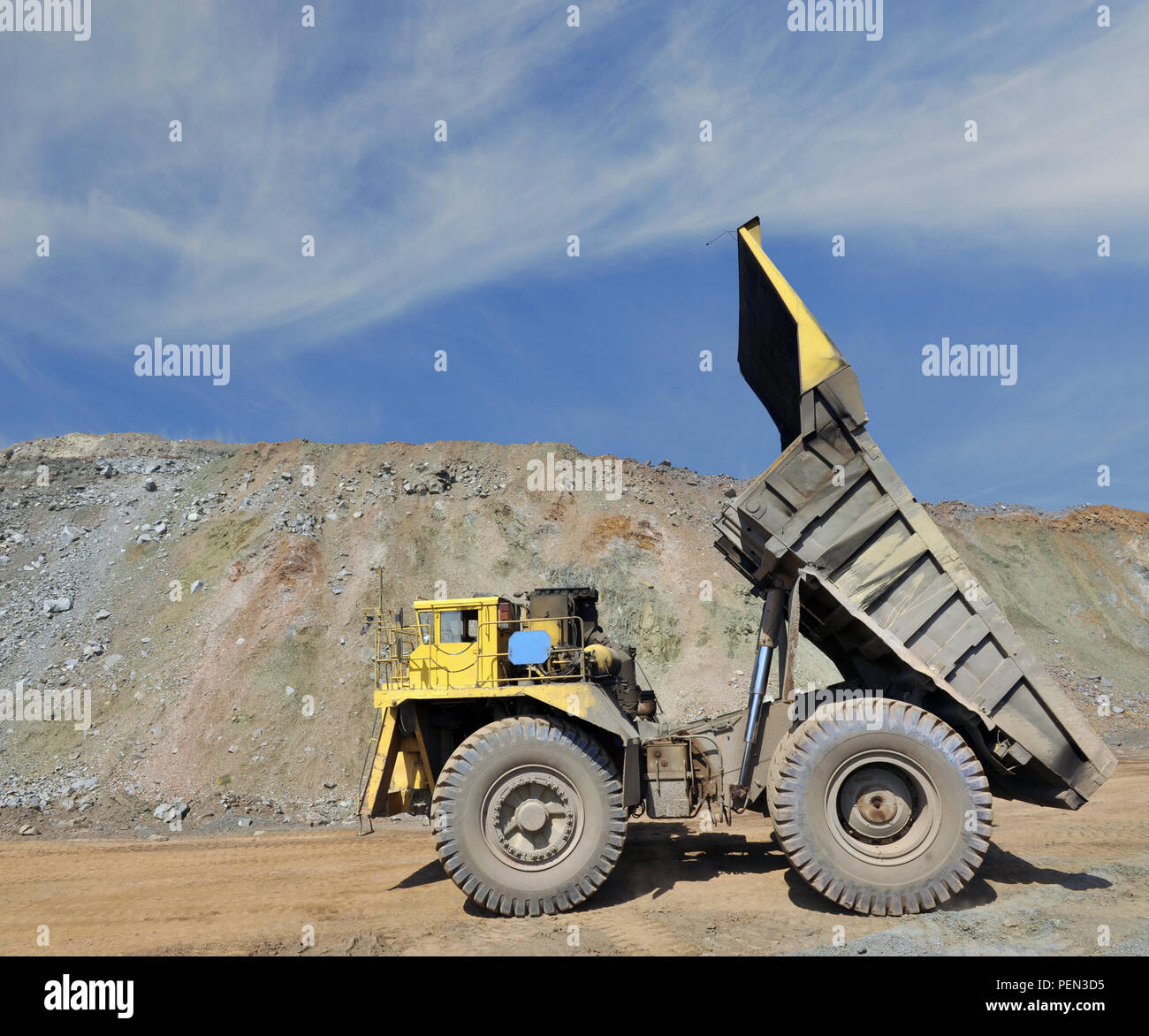 unloading truck in a career of iron ore Stock Photo - Alamy