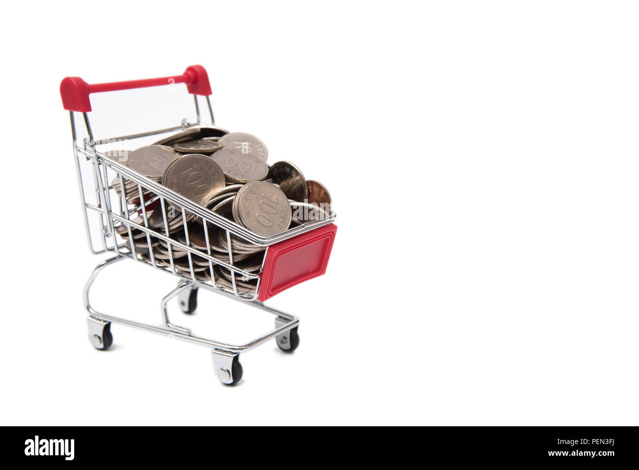 Shopping cart full of coin on white background Stock Photo - Alamy