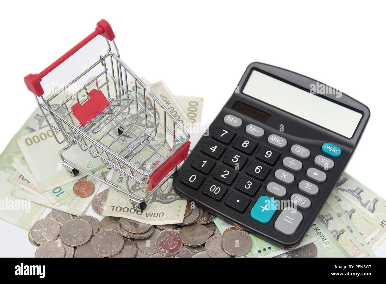 Shopping carts and calculator over stacked coins and banknotes Stock ...