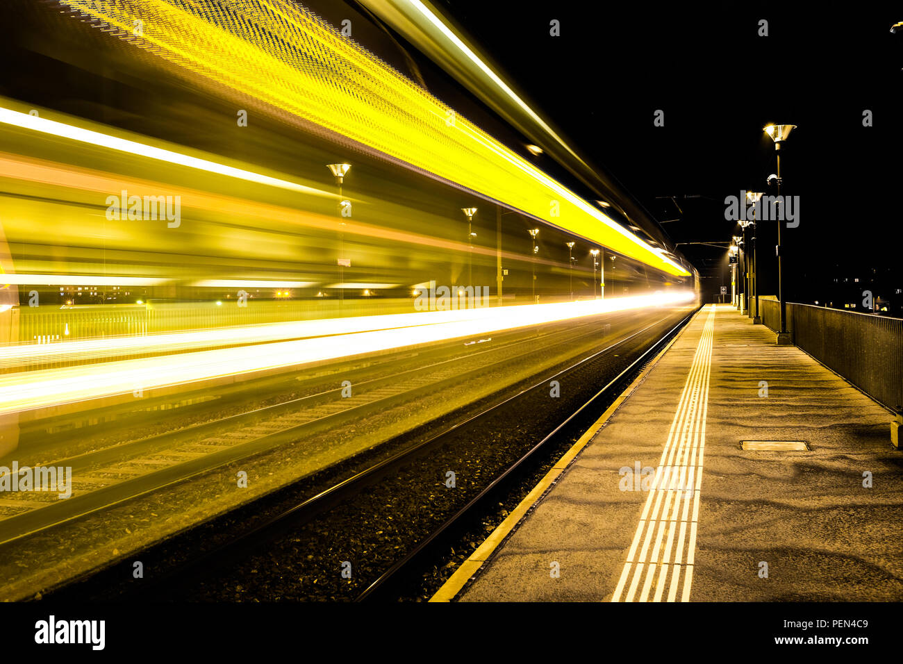 Long exposure shot of a train entering the station of Fribourg, in ...