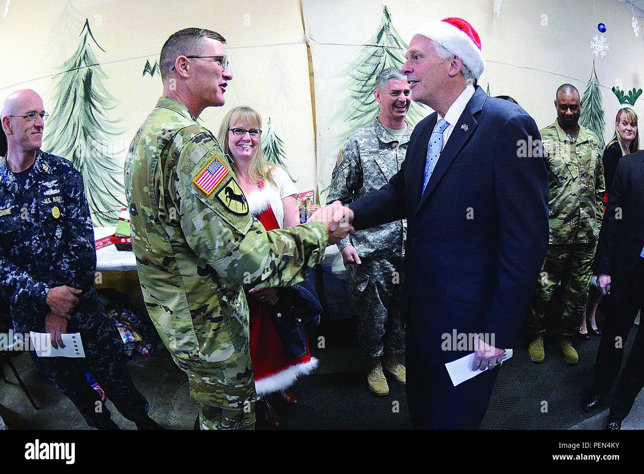 Col. Robert Hatcher Jr., CASCOM chief of staff, shakes hands with Gov ...