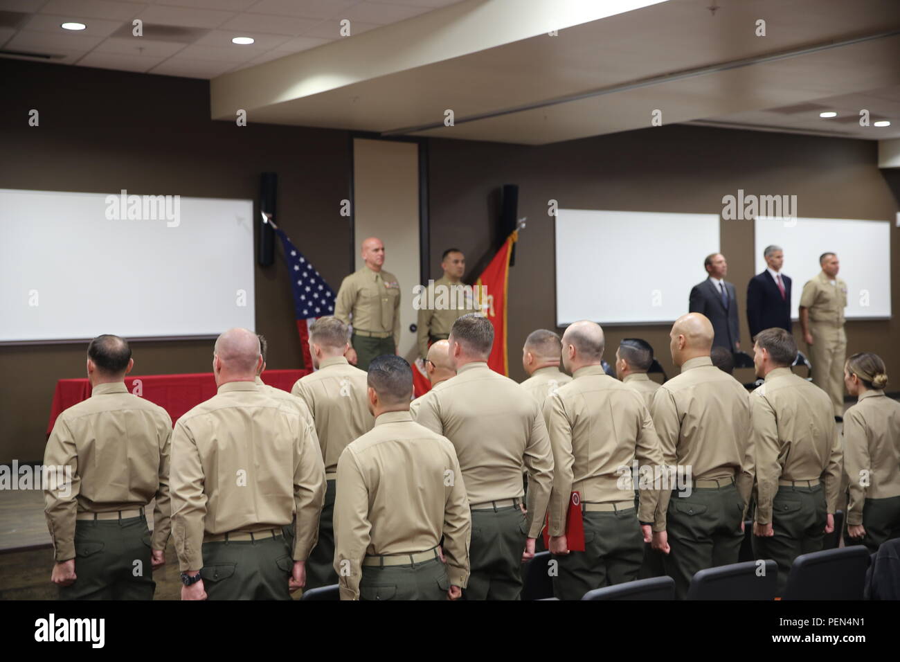 Marines and guests of the Expeditionary Warfare School graduation stand ...