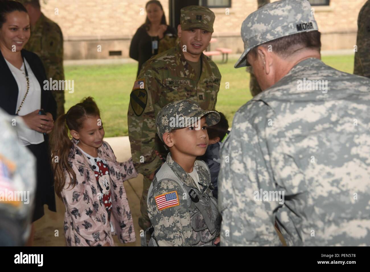 As Diego's parents and sister look on, the HHBN Company Commander, Capt ...