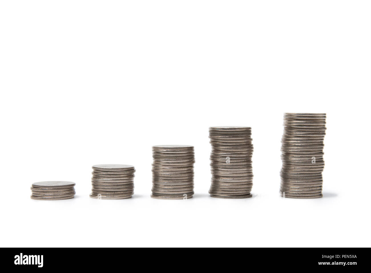 Coin stacks on a white background. Isolated Stock Photo - Alamy