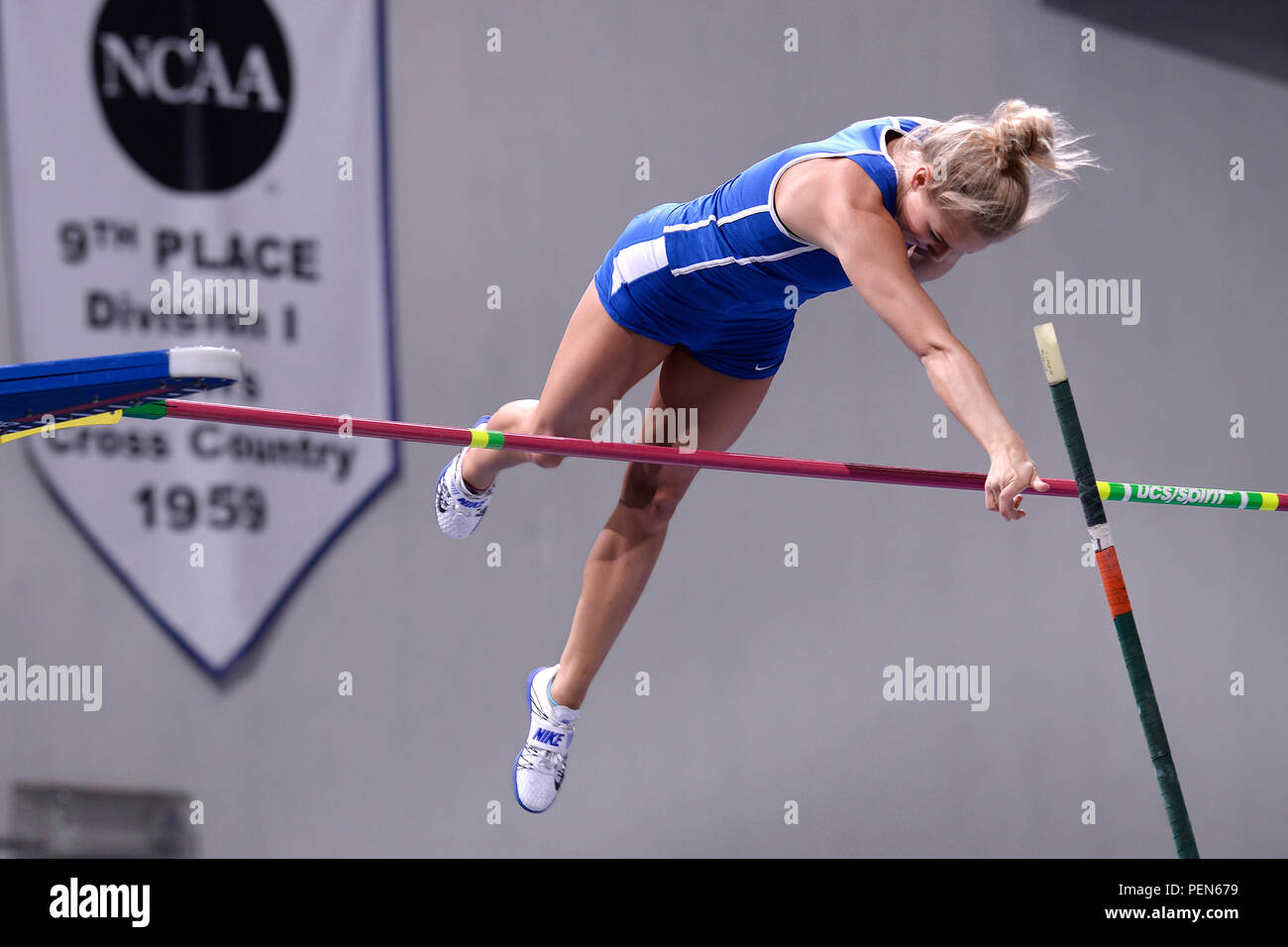 Riley Vann, a senior, clears the bar in the pole vault competition in ...