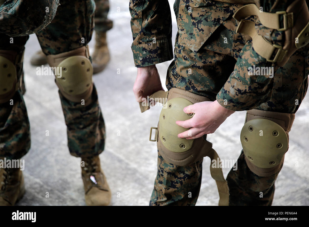 A Marine with 2nd Supply Battalion, 2nd Marine Logistics Group puts on ...