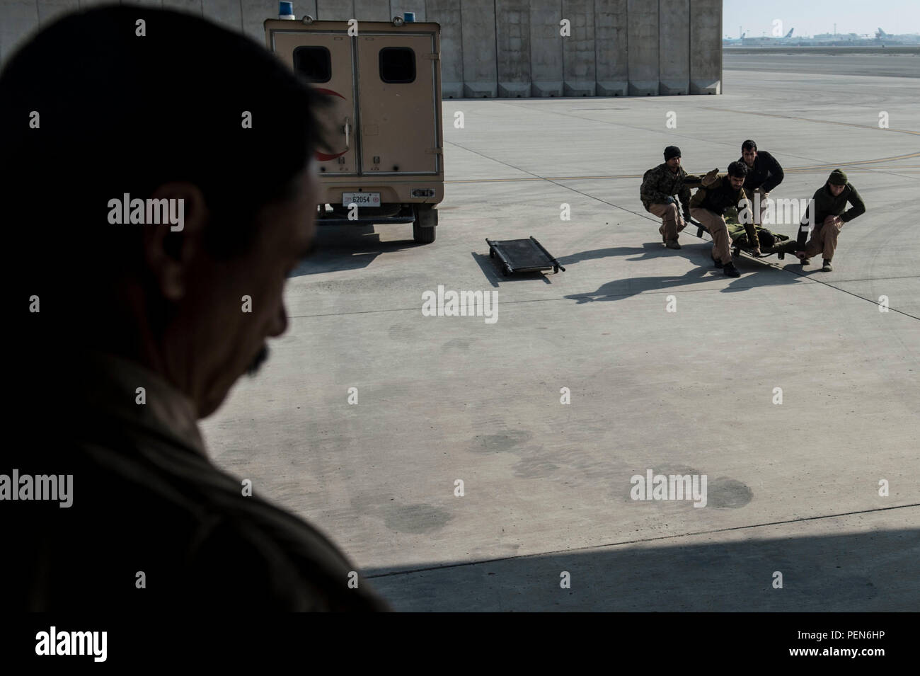 Afghan air force members perform a four-man litter carry to an Afghan ...