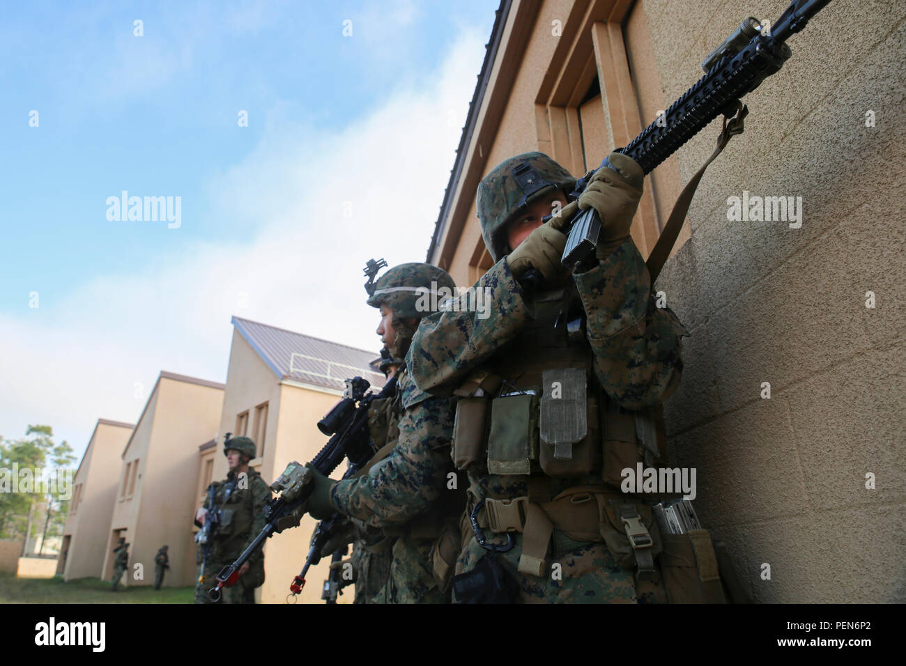 Marines with 3rd Battalion, 6th Marine Regiment, engage an opposing ...