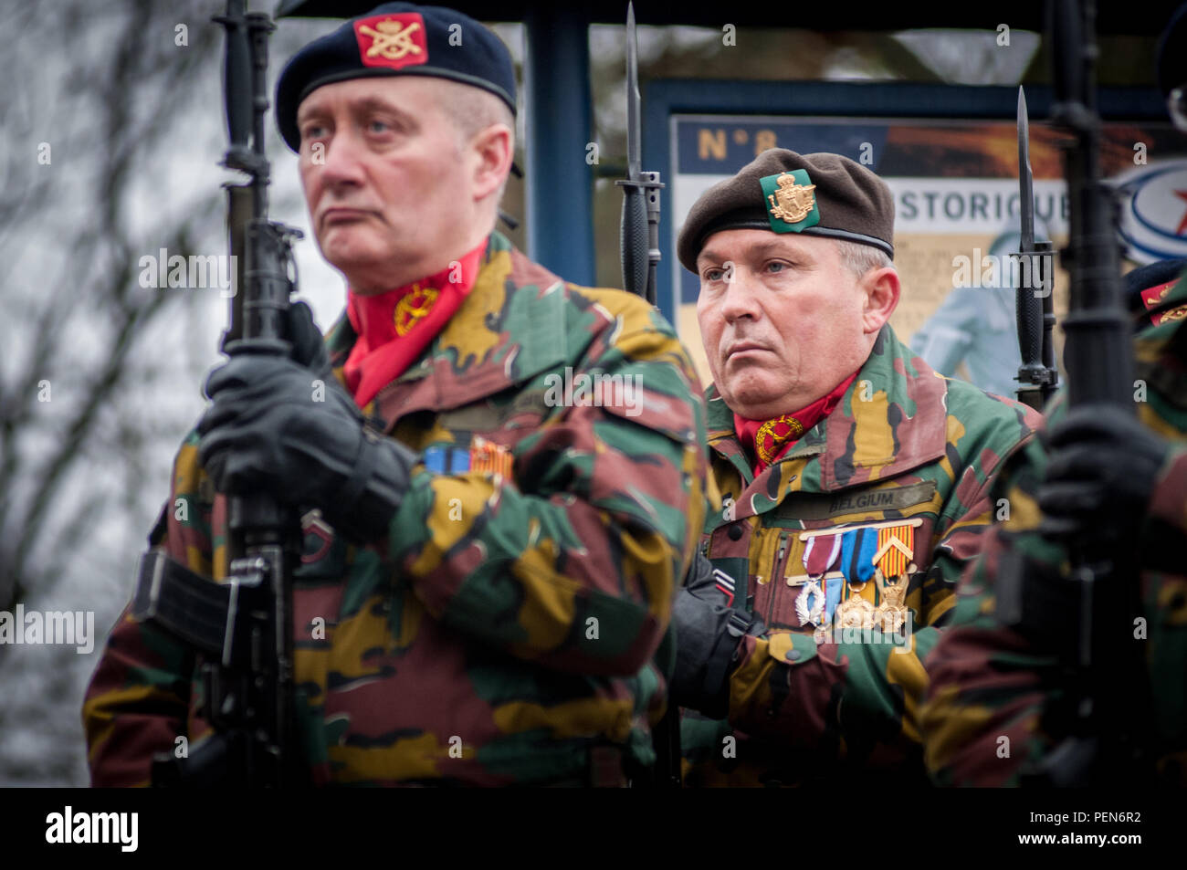 Belgian soldiers observe military protocol while standing at the ...