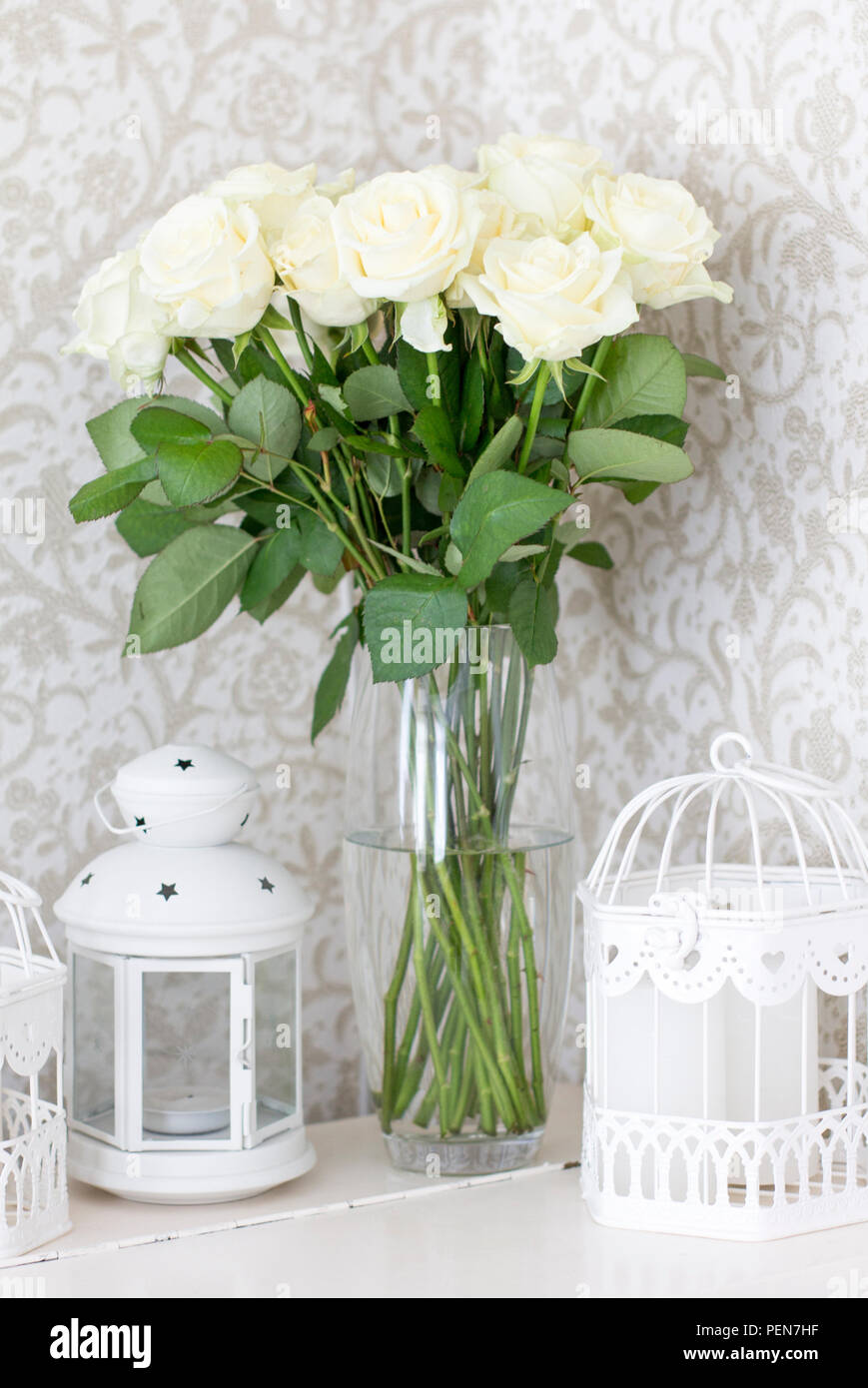 Bouquet of white roses in a vase. White roses and decorative cells ...