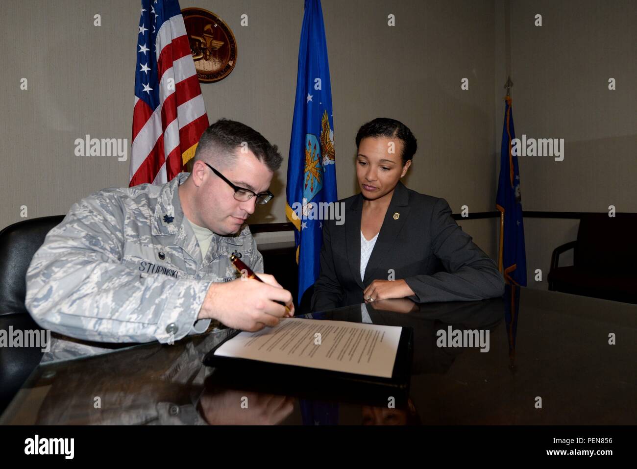 Lt. Col. Daniel Stupinski, 42nd Contracting Squadron commander, left ...