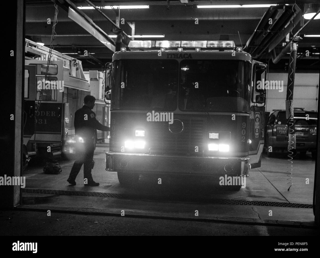 James Wheal, Ithaca Fire Department shift lieutenant, helps guide ...