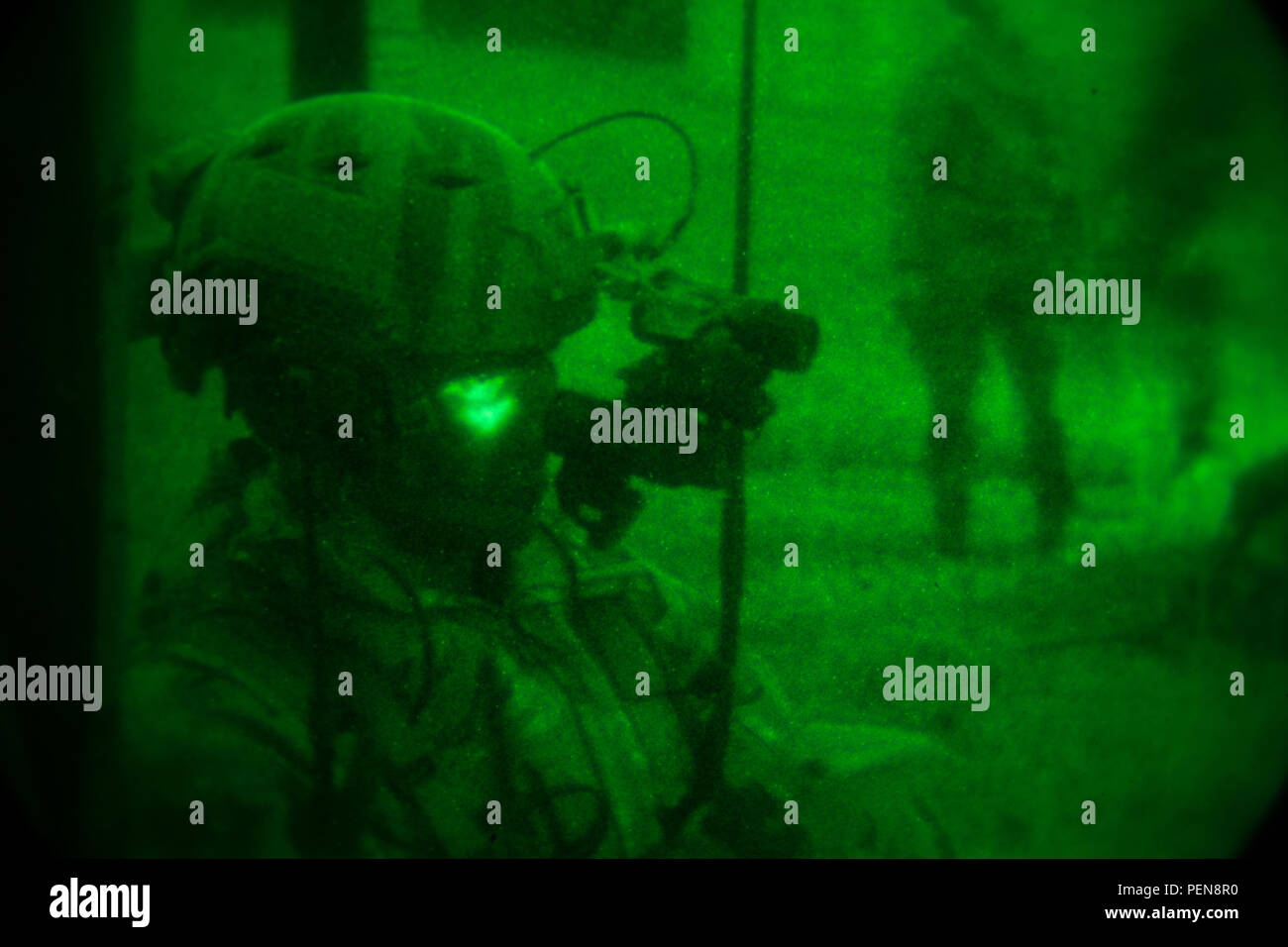 An Air Force joint terminal attack controller participates in a raid ...