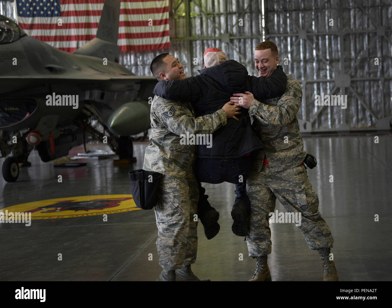 An observer congratulates U.S. Air Force Staff Sgt. Nathan Hadama, 35th ...