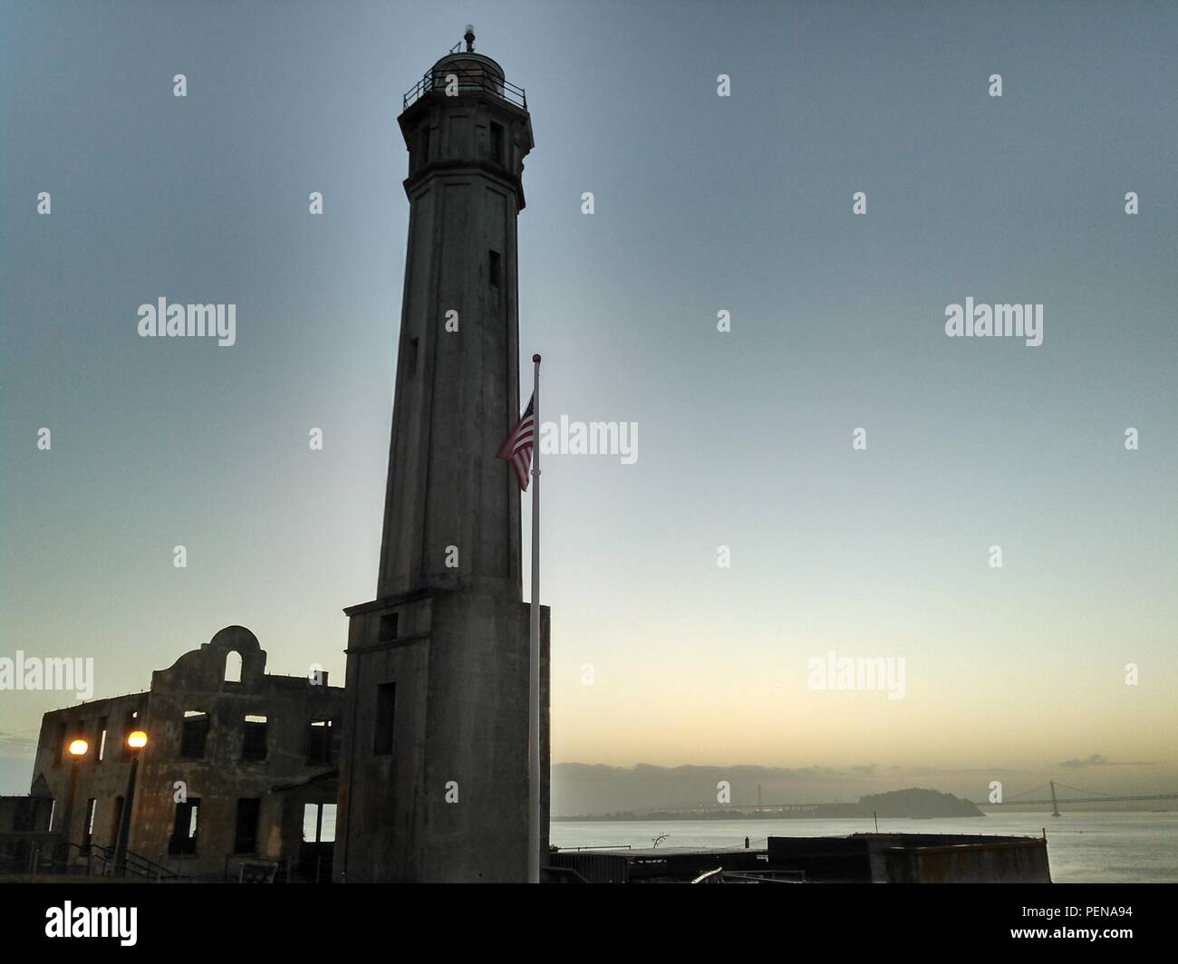 Pictured is Alcatraz Lighthouse on San Francisco Bay during sunrise ...