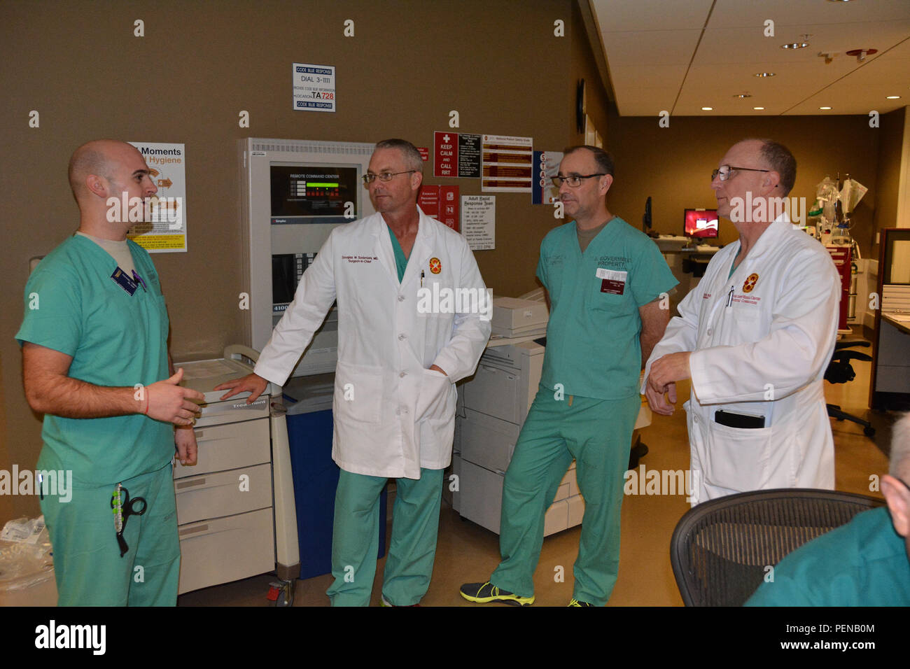 Air Force 1st Lt. Tomas Pasvogel, a clinical nurse, speaks with (from ...