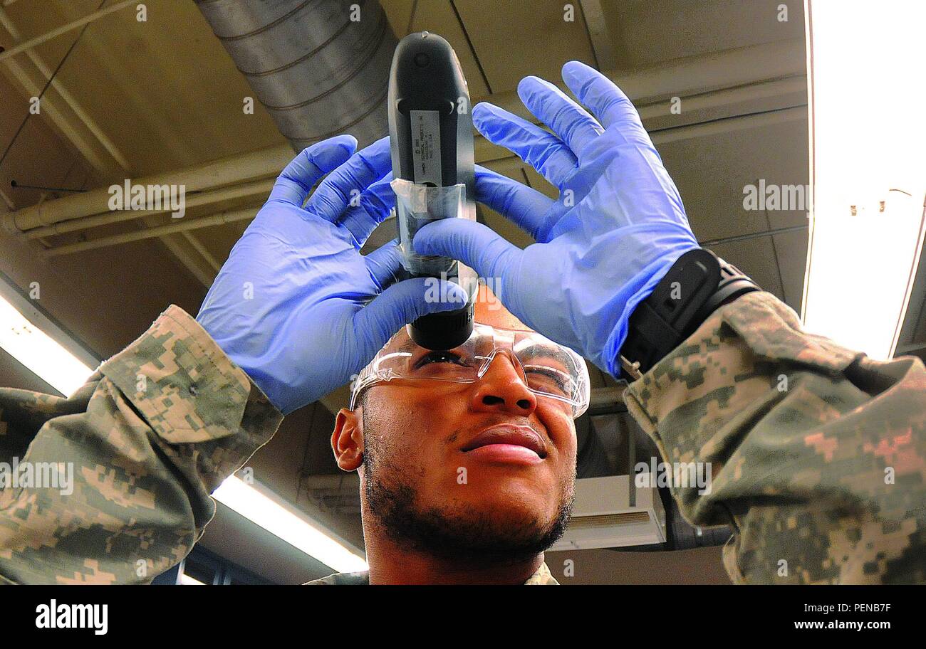 Petroleum Laboratory Specialist Course student Pvt. Evan Mays uses a ...