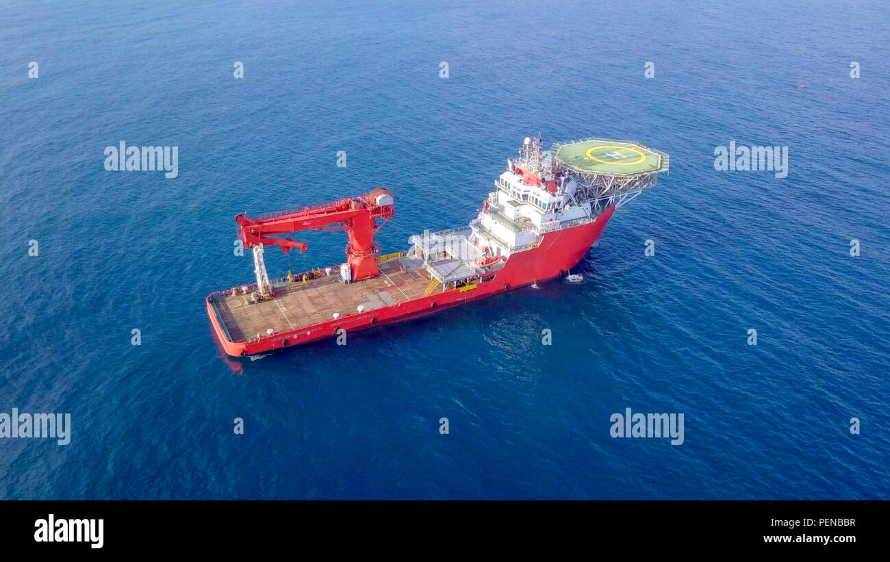 Aerial image of a Medium size red Offshore supply ship with a Helipad ...
