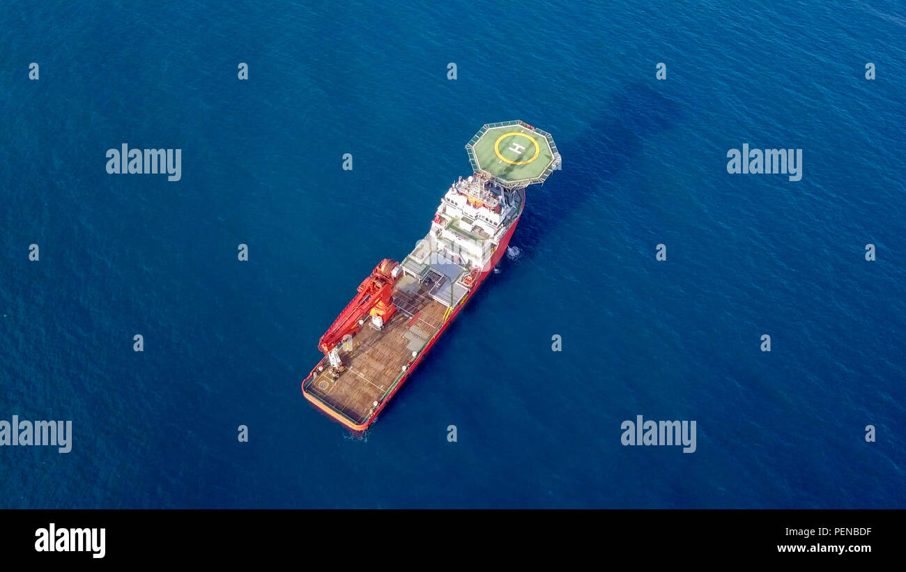 Aerial image of a Medium size red Offshore supply ship with a Helipad ...