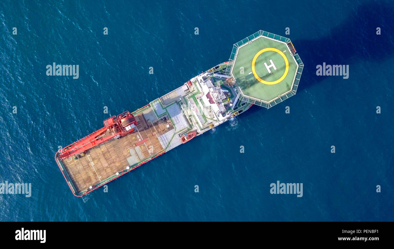 Aerial image of a Medium size red Offshore supply ship with a Helipad ...