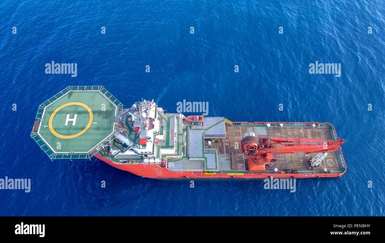 Aerial image of a Medium size red Offshore supply ship with a Helipad ...