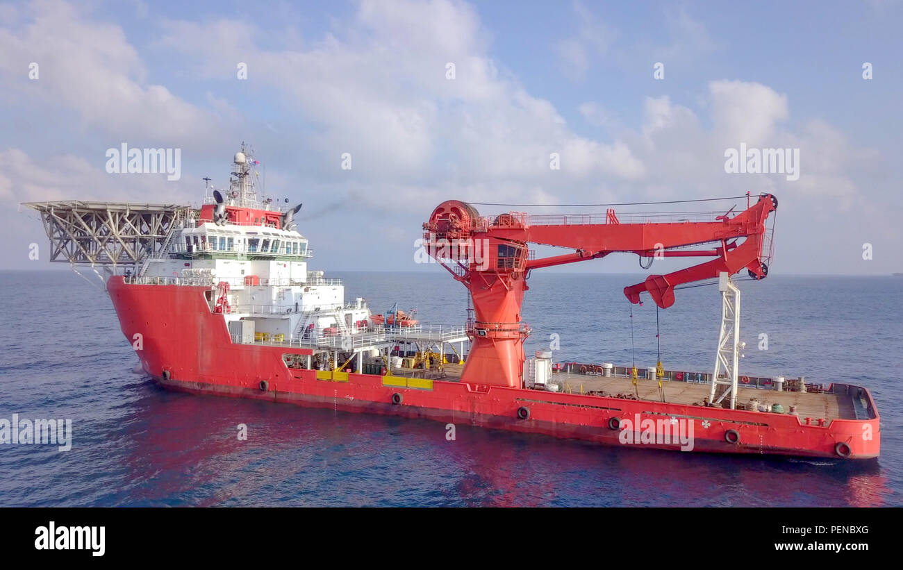 Aerial image of a Medium size red Offshore supply ship with a Helipad ...
