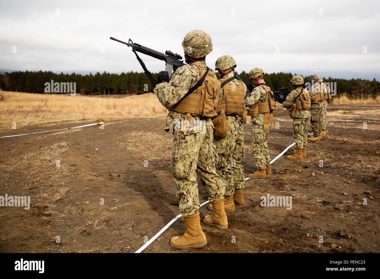 Sailors load magazines into M4 carbine rifles during combat ...